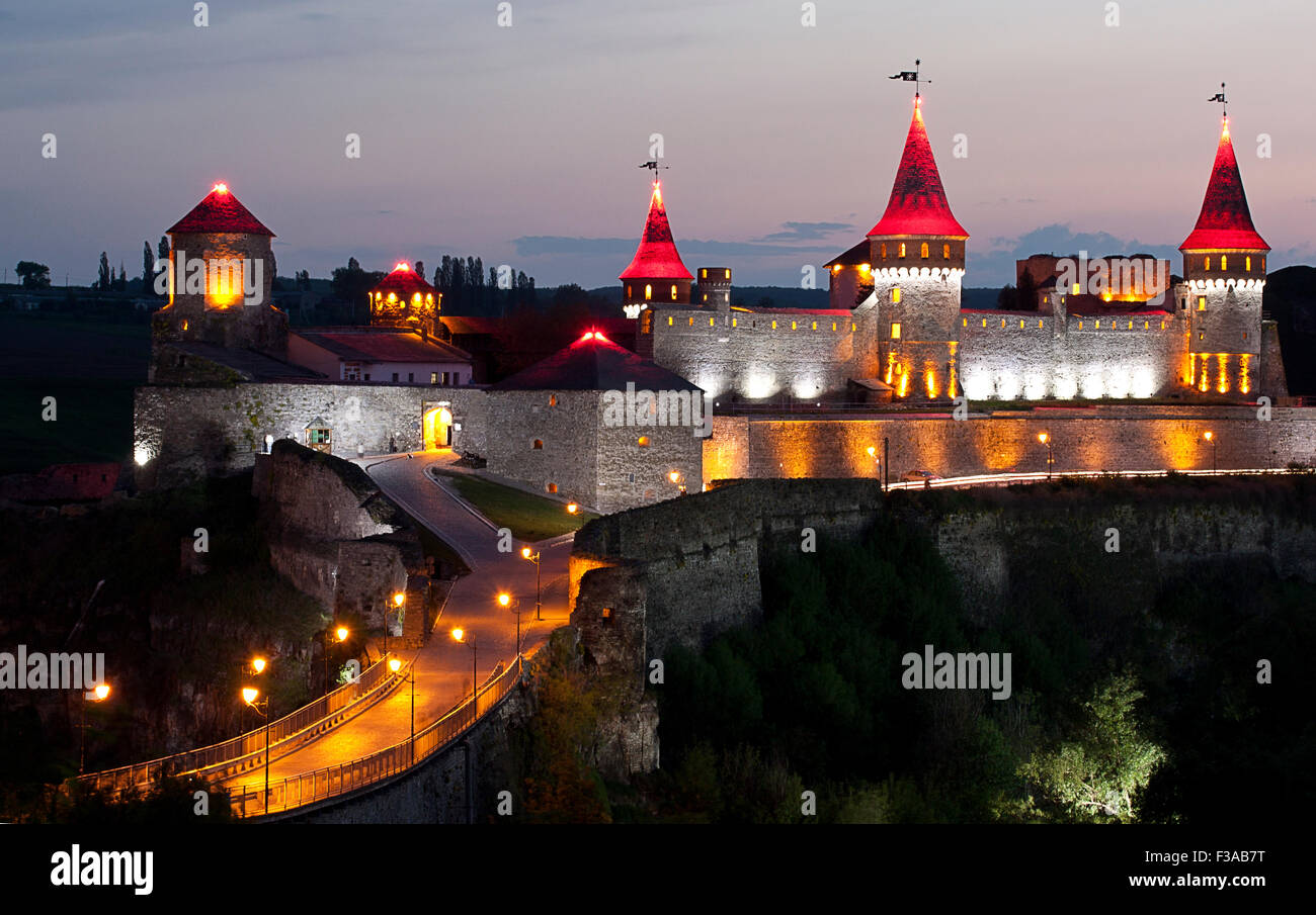 Night panoramic view of medieval half-ruined castle in Kamenetz-Podolsk ...