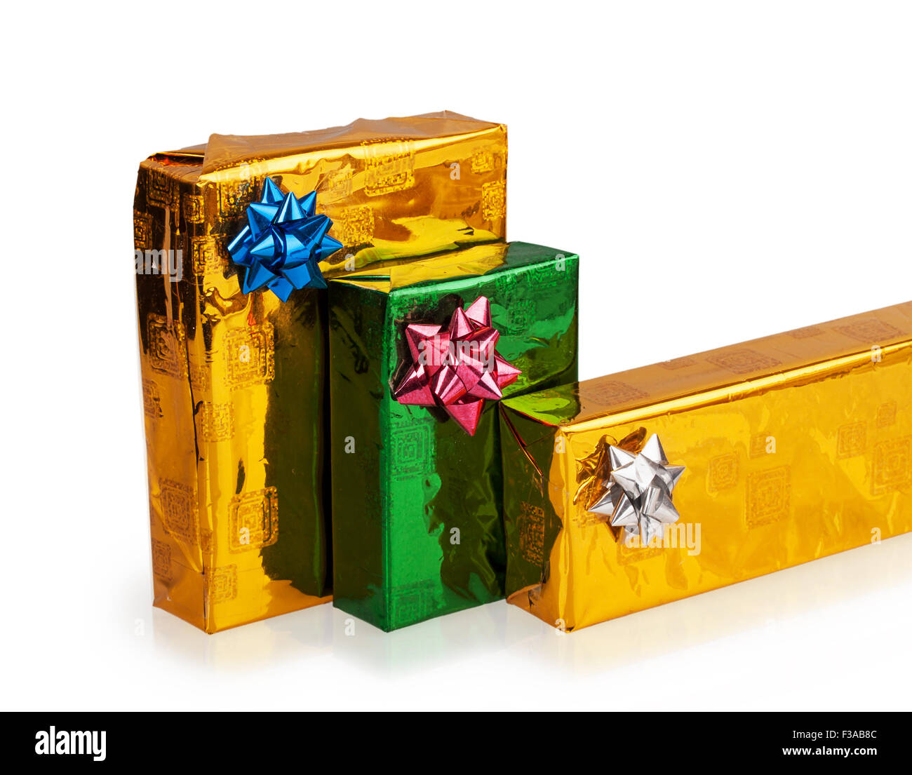 Three colored beautiful boxes with gifts isolated on white background ...