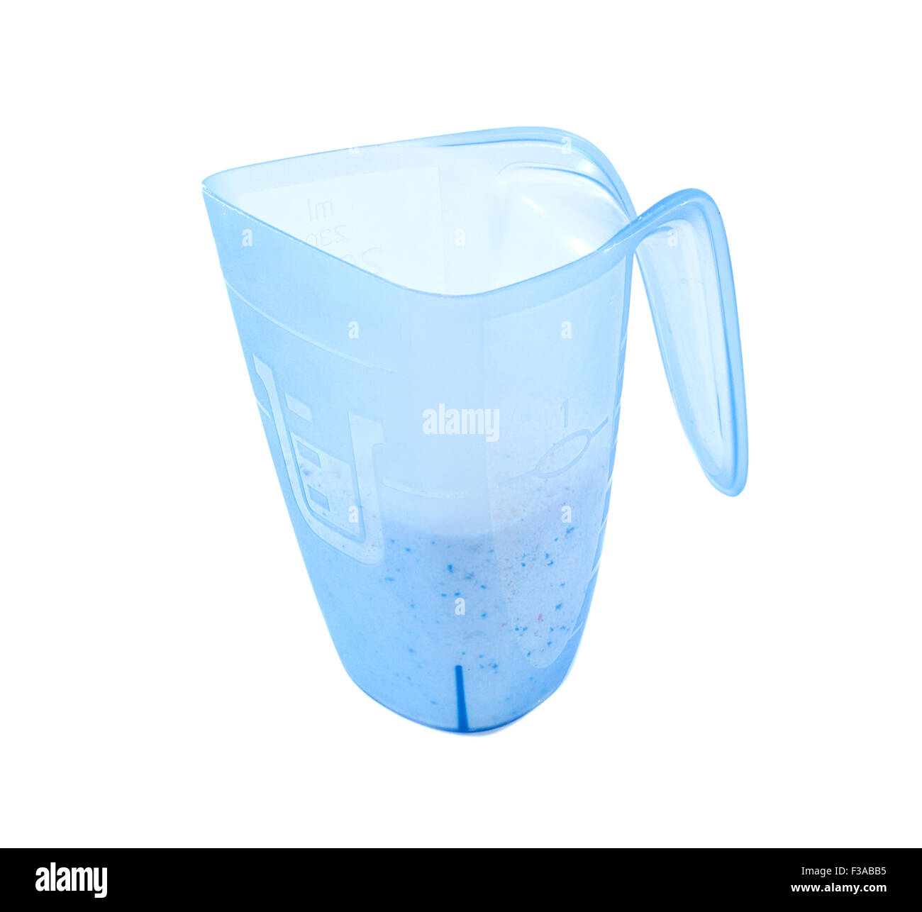 washing powder in a measuring cup isolated on white background Stock ...
