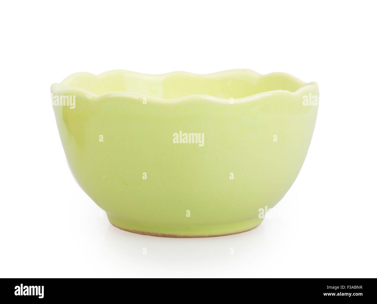 Green ceramic bowl isolated on white background Stock Photo - Alamy