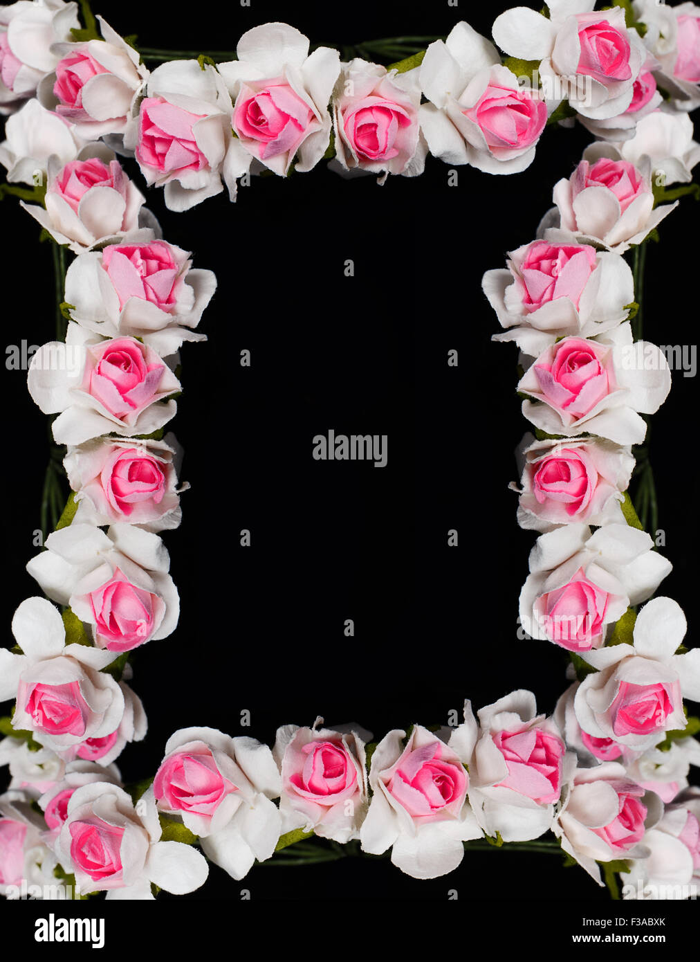 Frame made of paper roses on a black background Stock Photo - Alamy