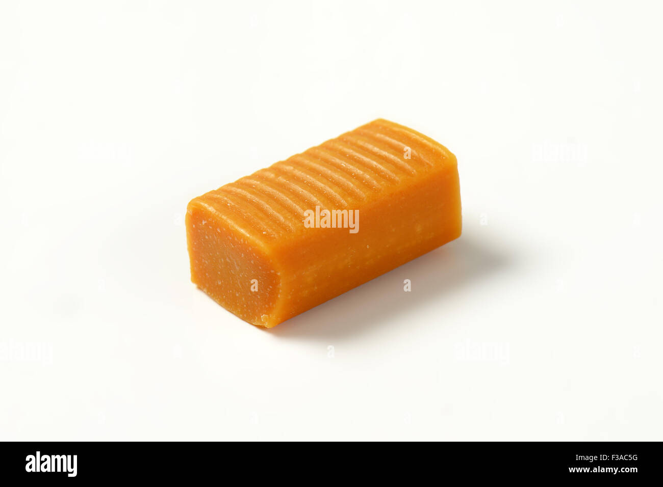 caramel toffee candy on white background Stock Photo - Alamy