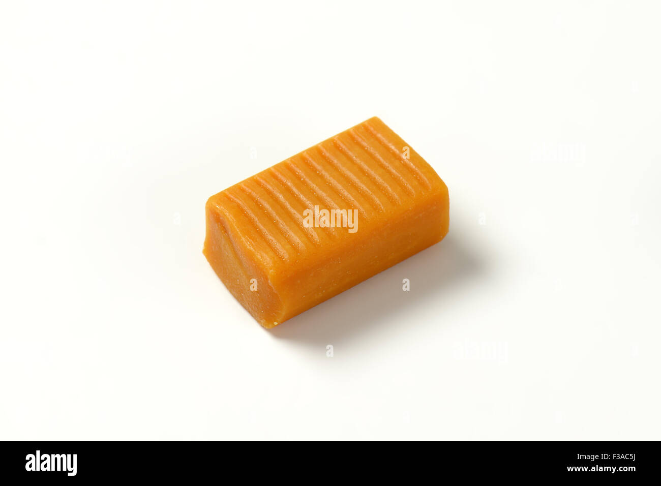 caramel toffee candy on white background Stock Photo - Alamy
