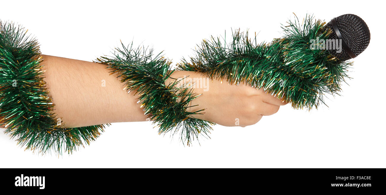 Female hand with green garland holding a microphone isolated on white ...