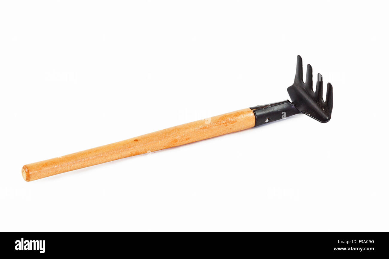 Garden rake is isolated on a white background Stock Photo - Alamy