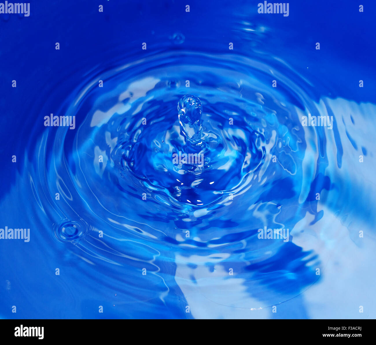 water drop splash in blue Stock Photo - Alamy