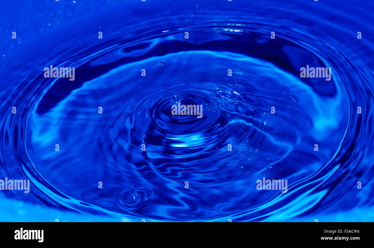 water drop splash in blue Stock Photo - Alamy