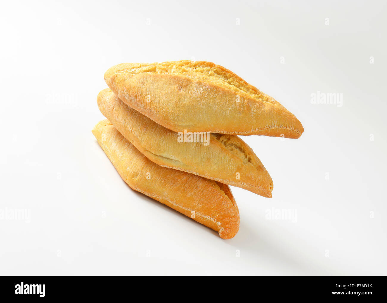 Three diamond-shaped crusty dinner rolls Stock Photo - Alamy