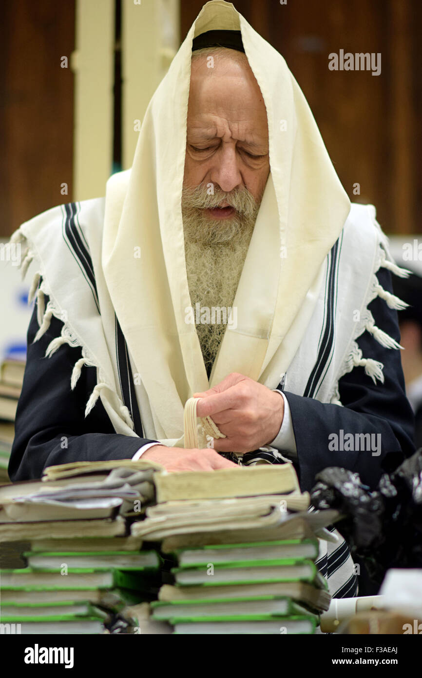 A very religious Jewish man at Sukkot morning services at a synagogue ...