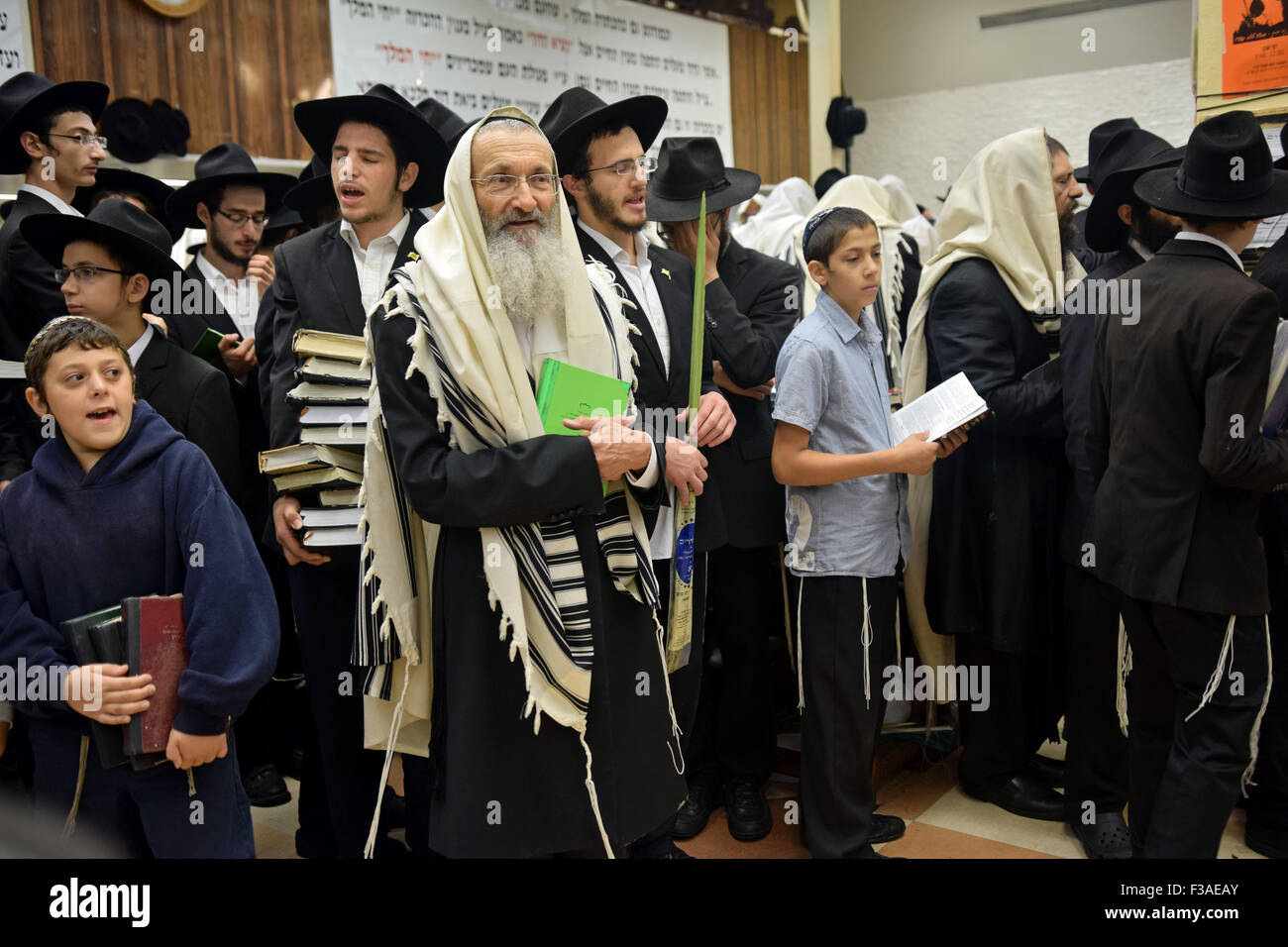 A diverse crowd of religious at Sukkot services in a synagogue in ...