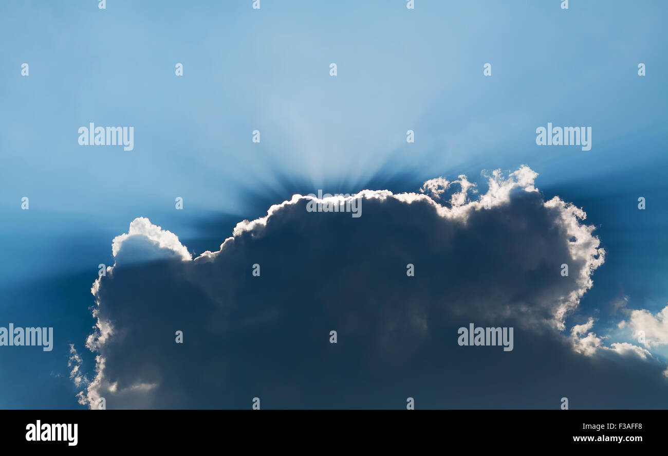 bright sunbeams breaking through the dark cloud Stock Photo - Alamy