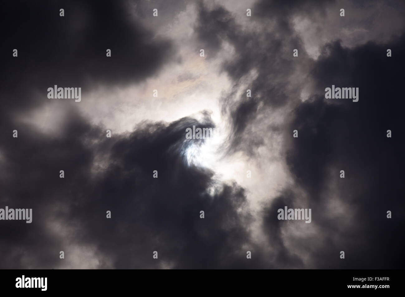 black thundercloud with sunbeam closeup Stock Photo - Alamy