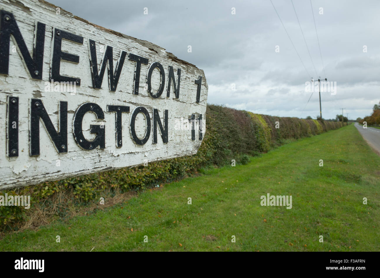 Old weathered wooden road sign Stock Photo - Alamy
