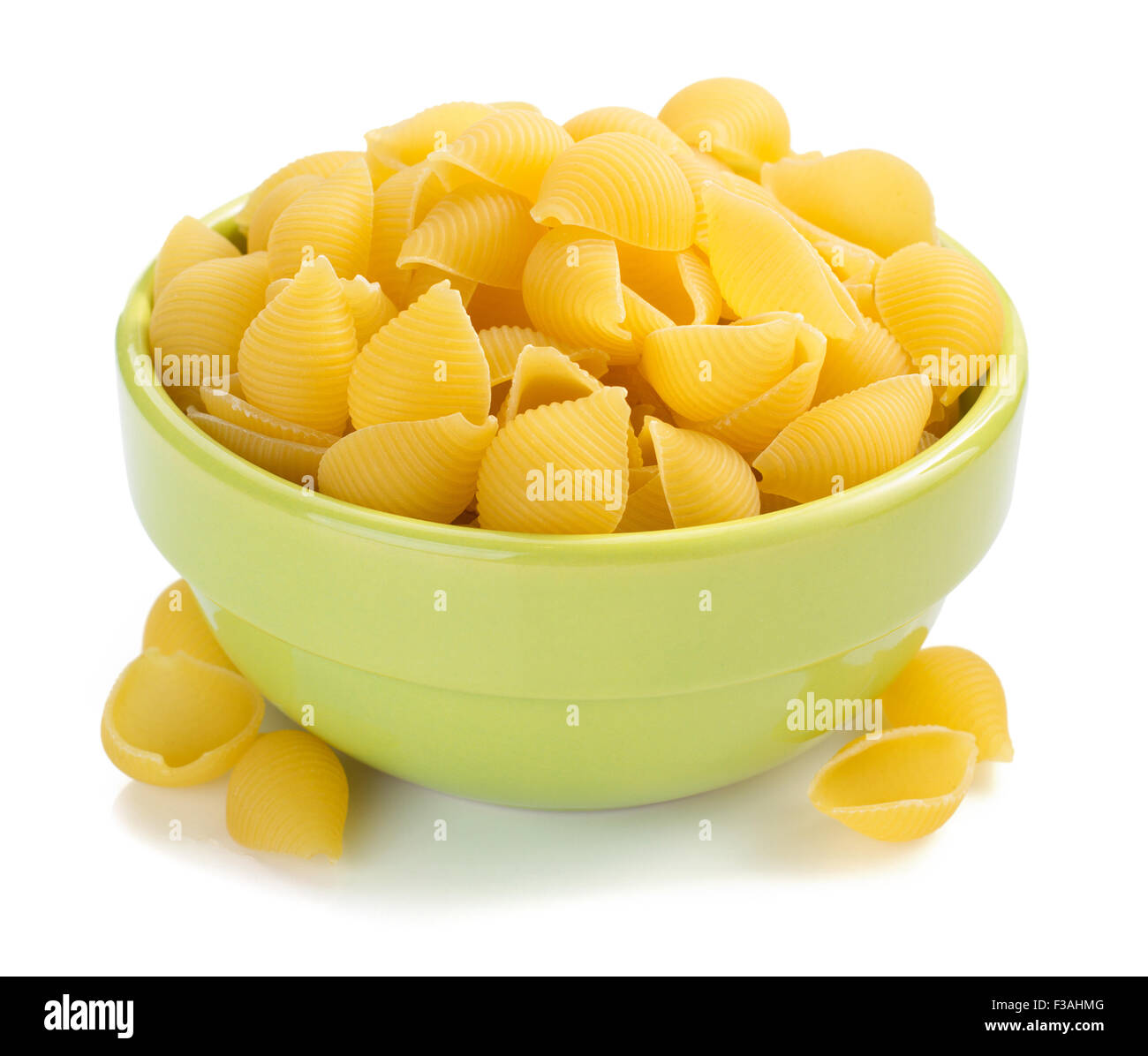 raw pasta in bowl isolated on white background Stock Photo - Alamy