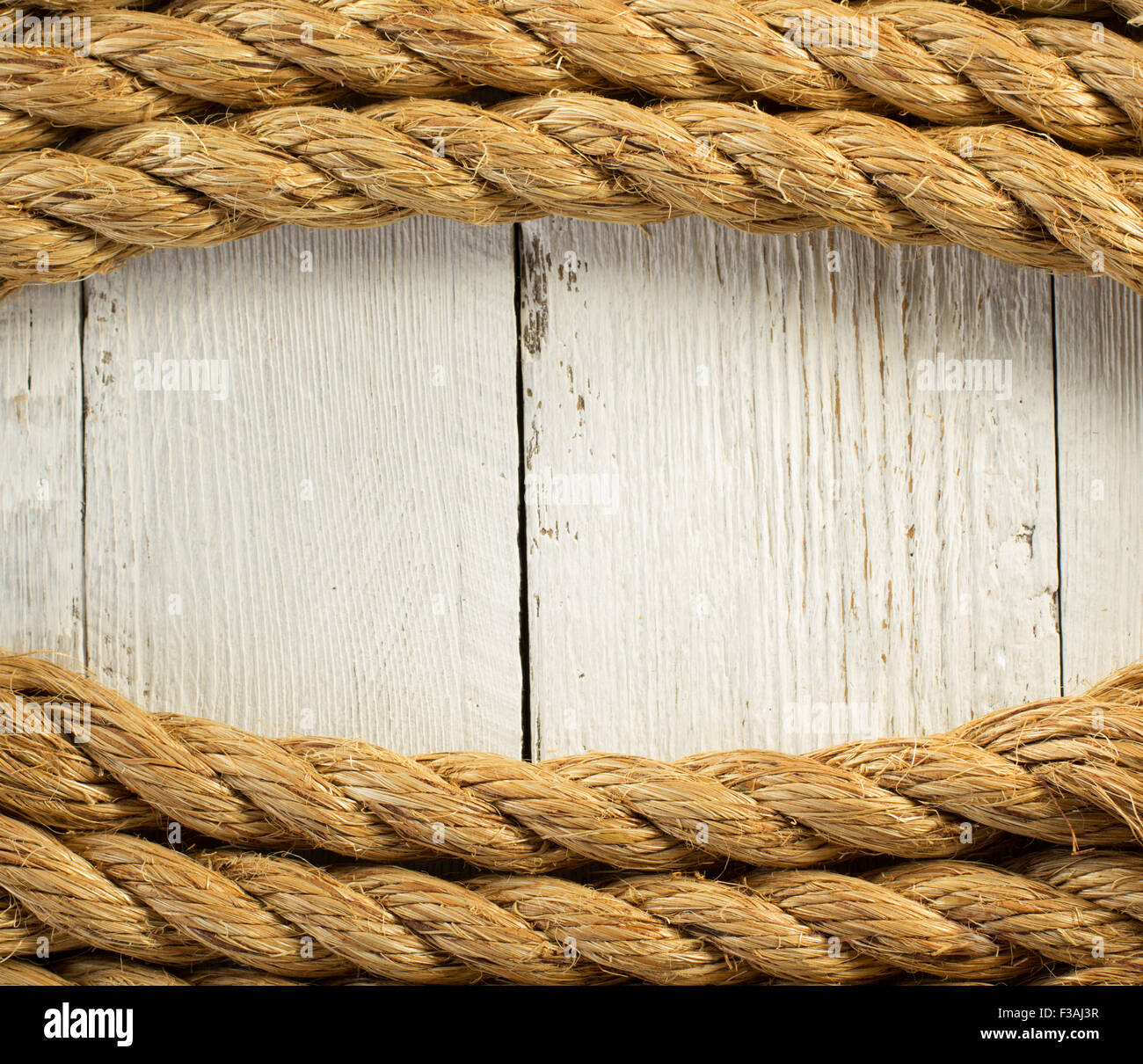 ship rope on wooden background Stock Photo - Alamy