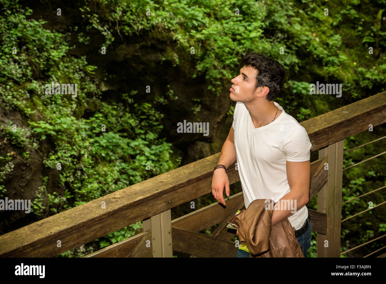 Leaning over rail hi-res stock photography and images - Alamy