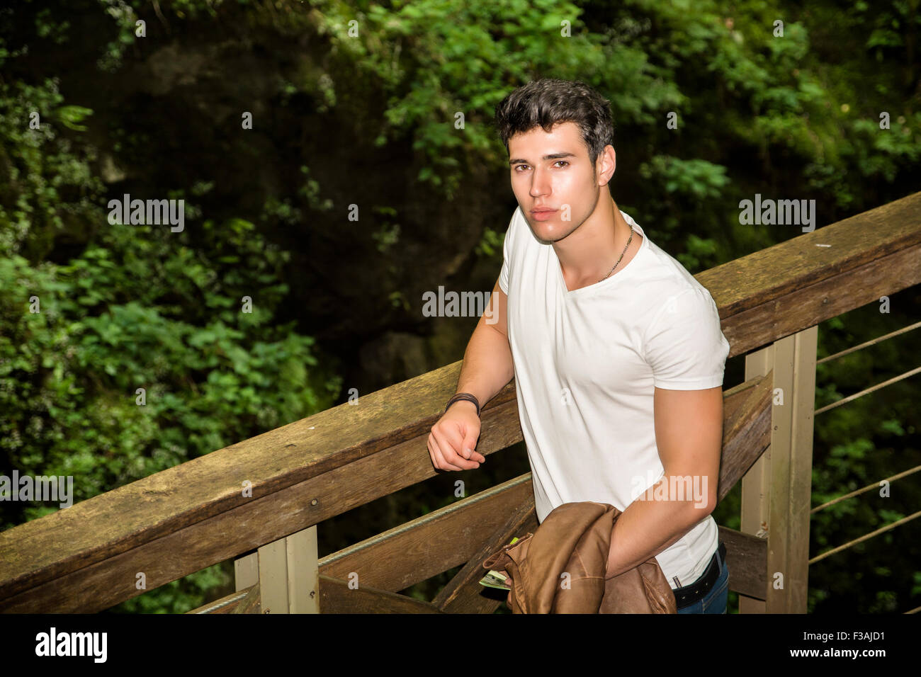 Leaning over rail hi-res stock photography and images - Alamy