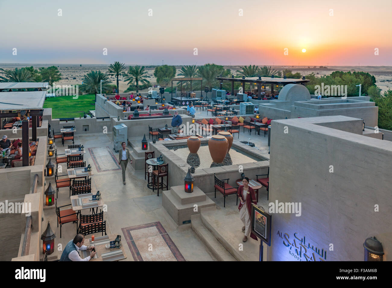 Sunset over the Dubai desert as seen from the Al Sarab rooftop lounge ...