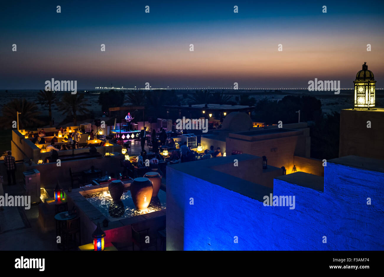 Sunset over the Dubai desert as seen from the Al Sarab rooftop lounge ...