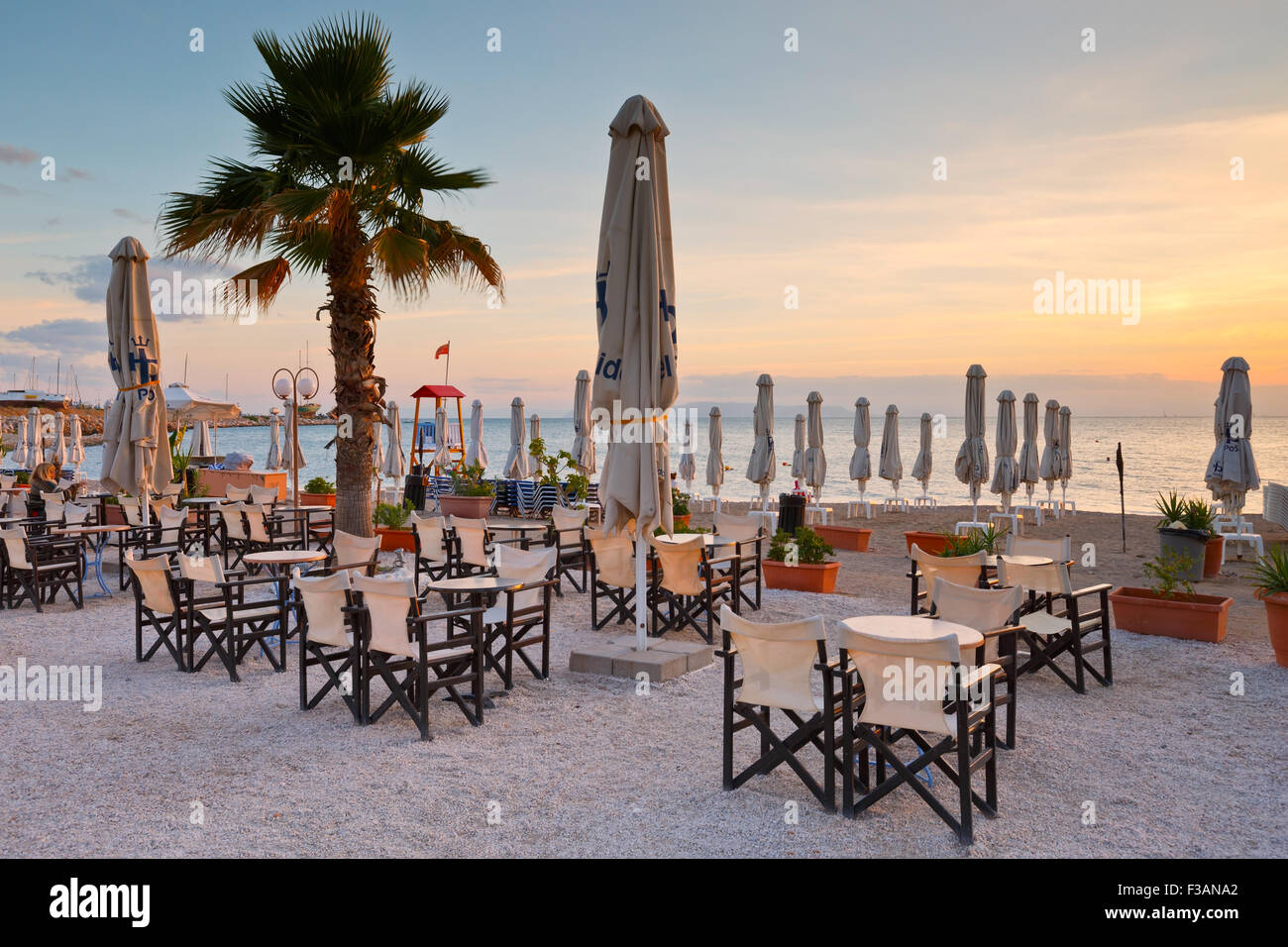 Umbrellas and tables on the beach in Palaio Faliro in Athens, Greece ...