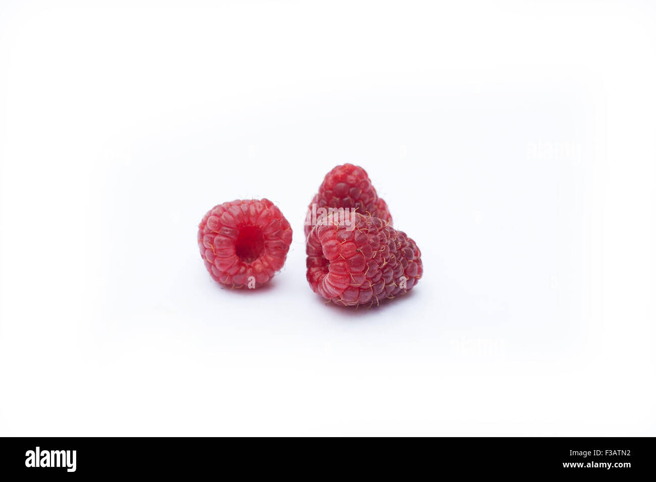 Fresh sweet red raspberry with leaves isolated on white Stock Photo - Alamy