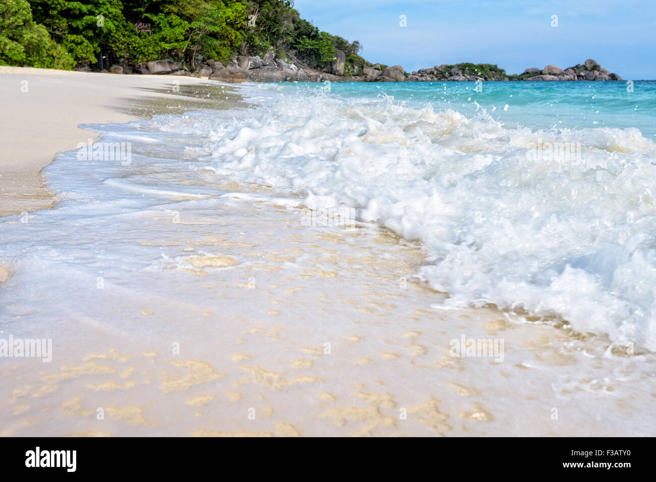 Beautiful landscape blue sea white sand and waves on the beach during ...