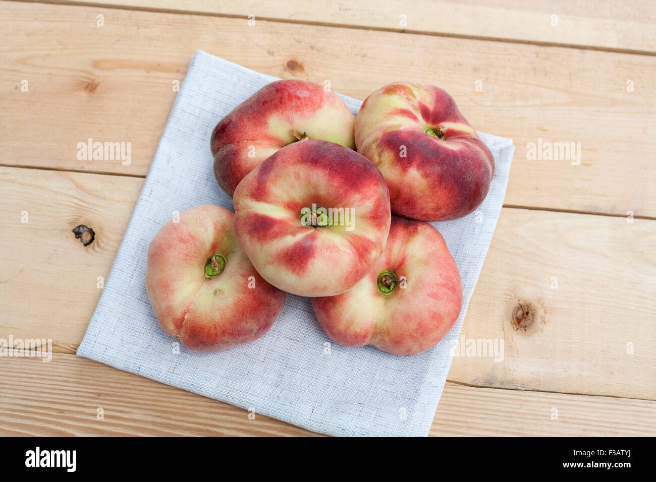 Ripe flat Chinese peaches Stock Photo - Alamy