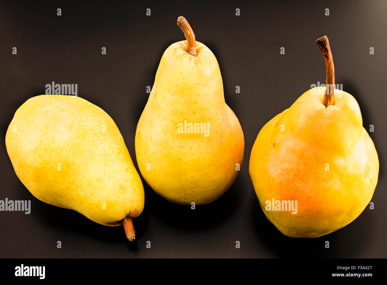 Three pears isolated on the black Stock Photo - Alamy