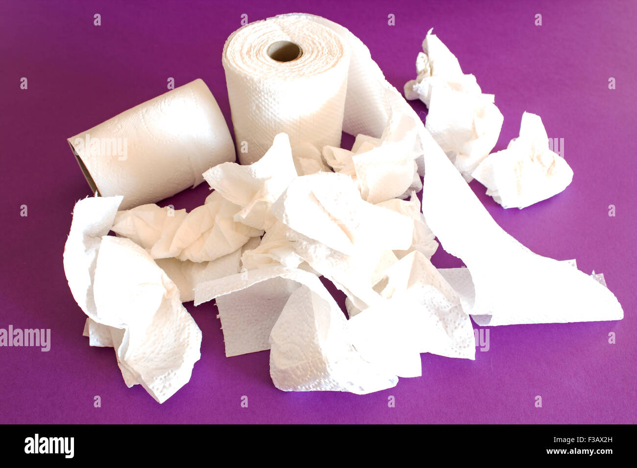 Used wipes on purple background Stock Photo - Alamy