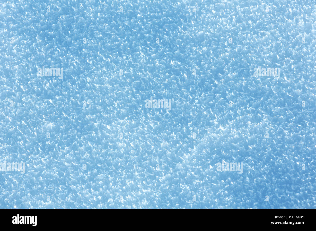 Snow crystals close-up. Snowy background Stock Photo - Alamy
