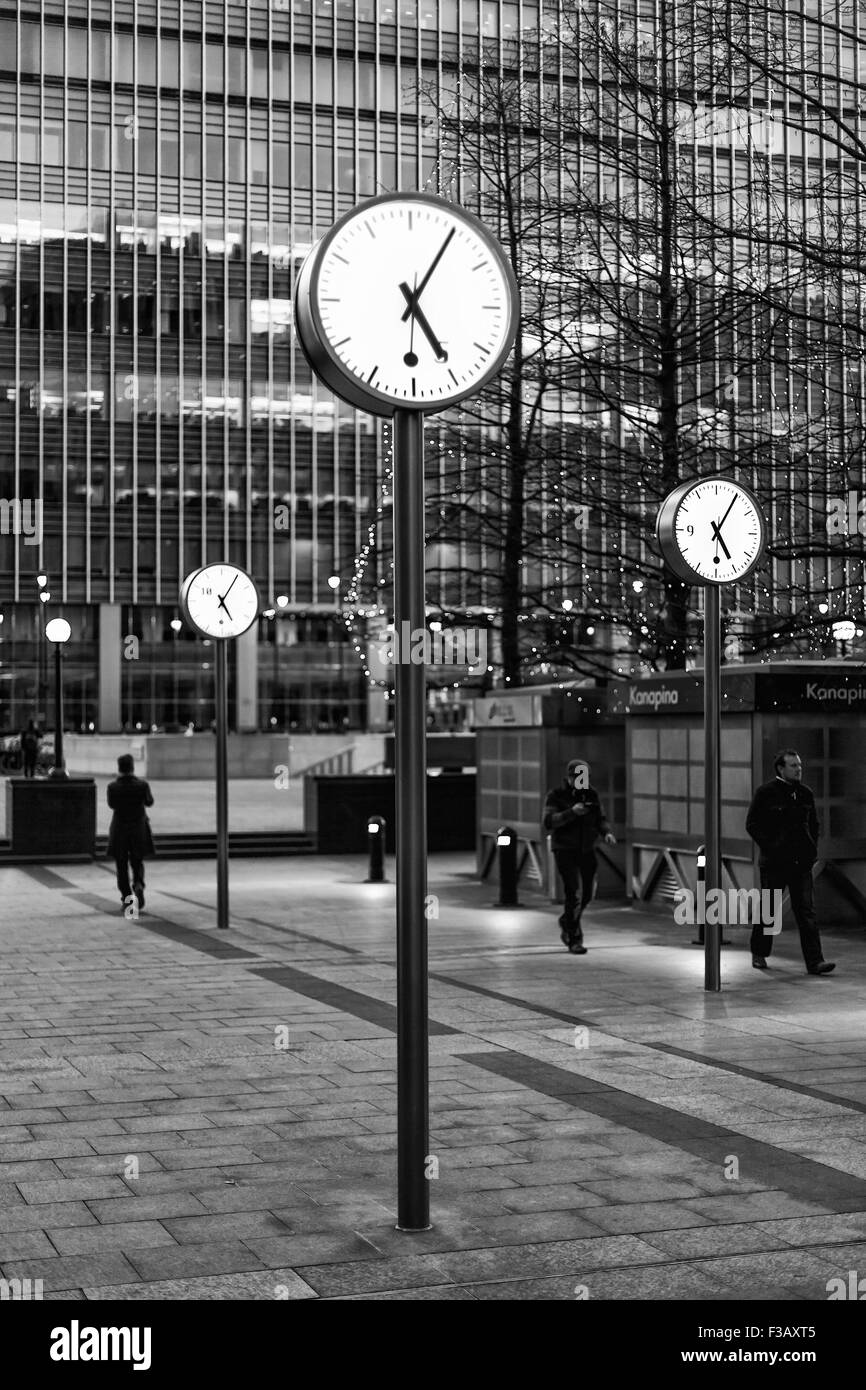 Clocks by Canary Wharf, London: Time Is Money Stock Photo - Alamy