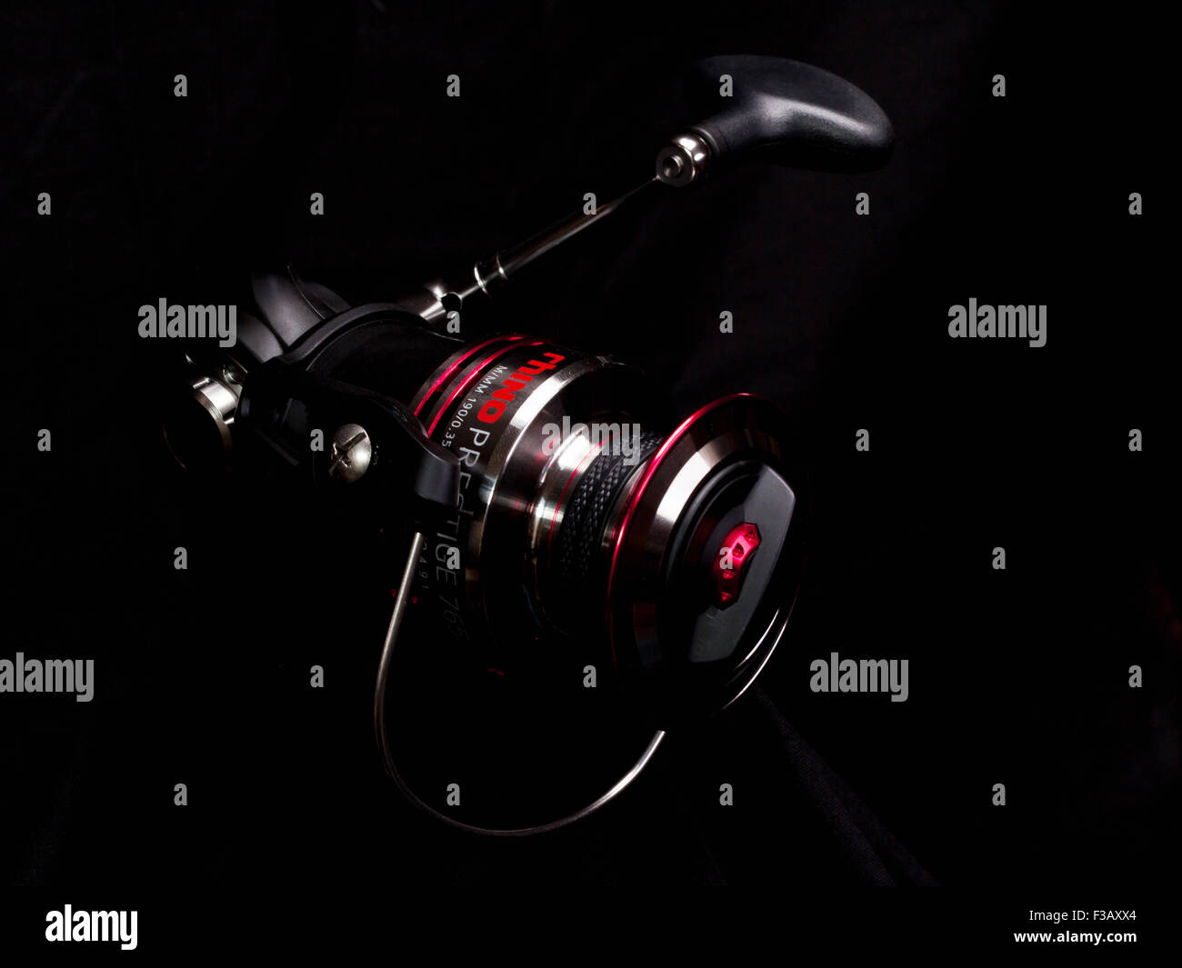 Red fishing reel Stock Photo - Alamy