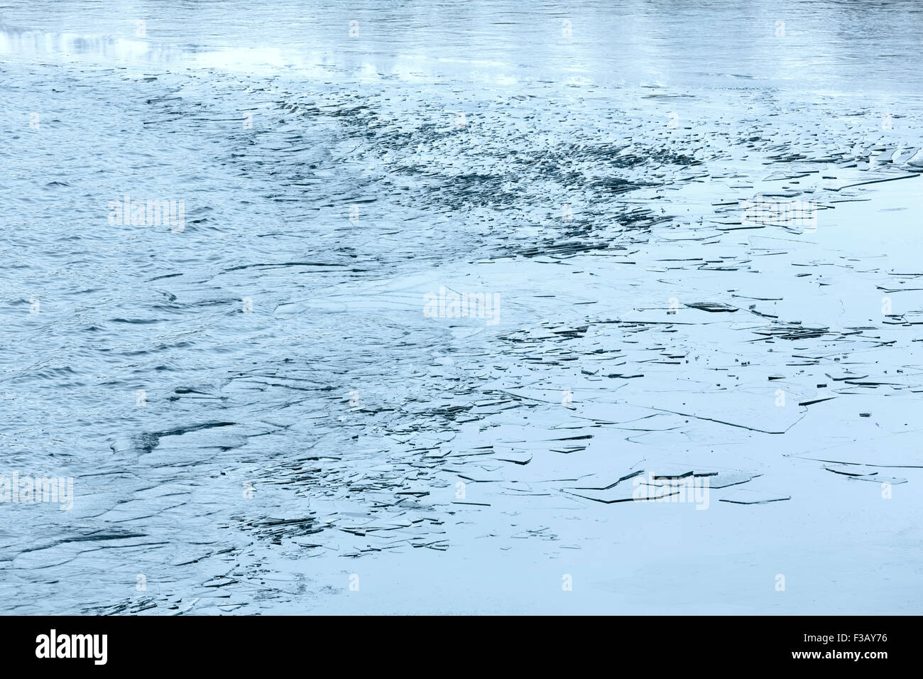Winter lake surface with thin ice Stock Photo - Alamy