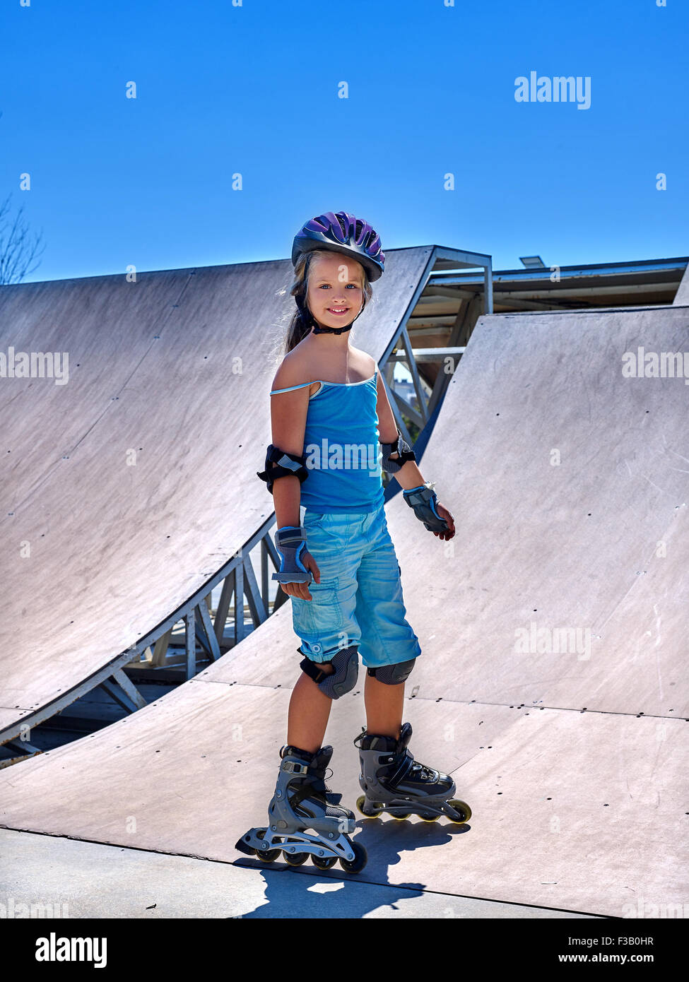 Girl riding on roller skates in skatepark Stock Photo - Alamy