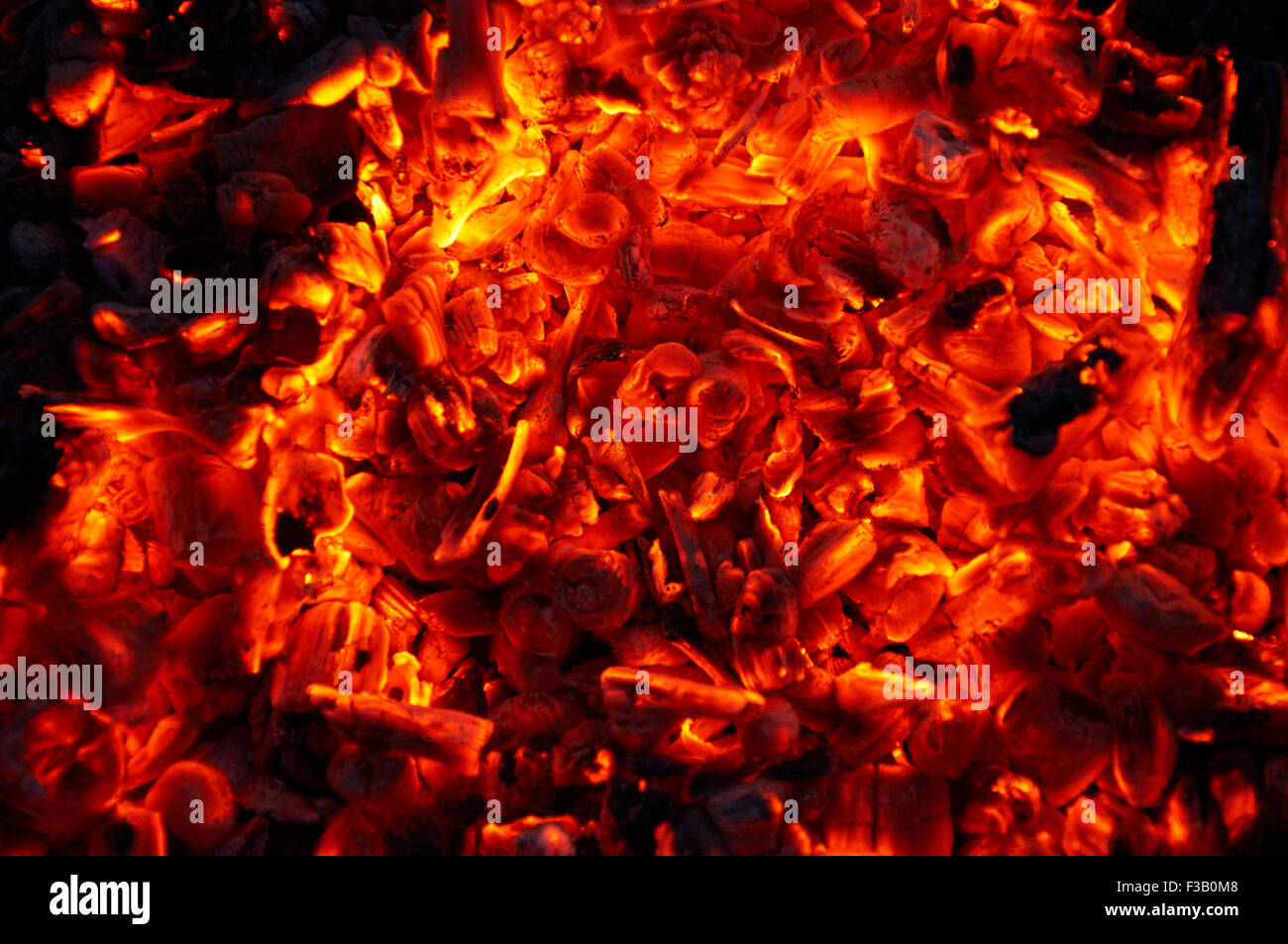 Smoldering charcoal. It is bright and hot Stock Photo - Alamy