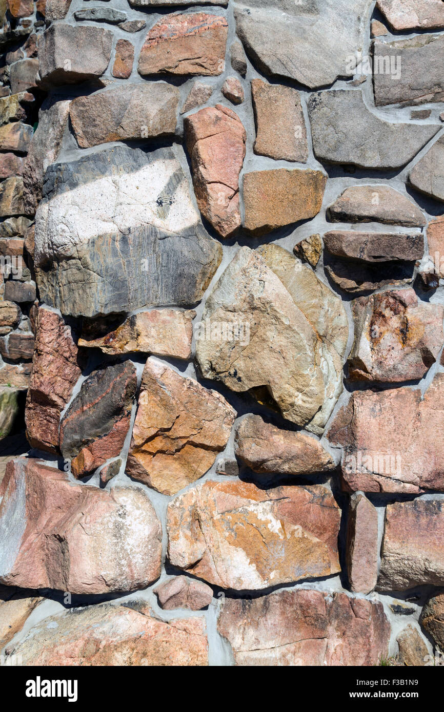 A man made wall made of colorful stone Stock Photo - Alamy