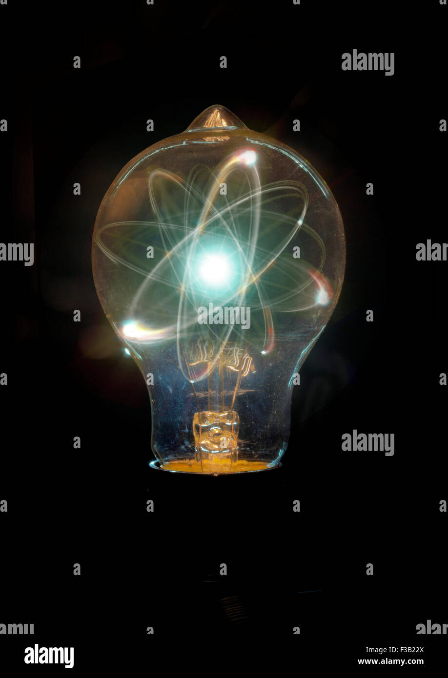 Atomic particle as lightbulb filament for nuclear energy imagery Stock ...