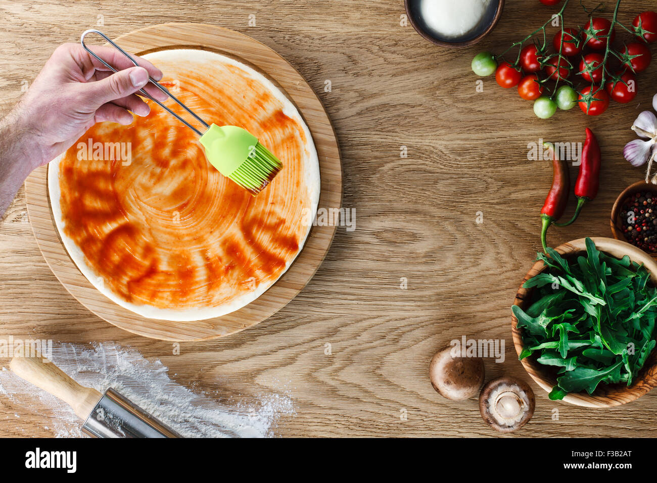 Spreading Pizza Sauce