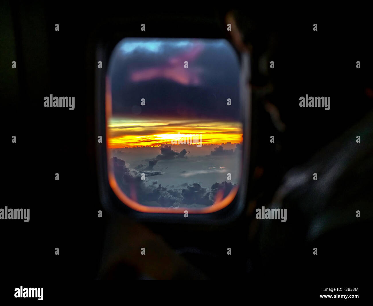 Sunset out airplane window Stock Photo - Alamy
