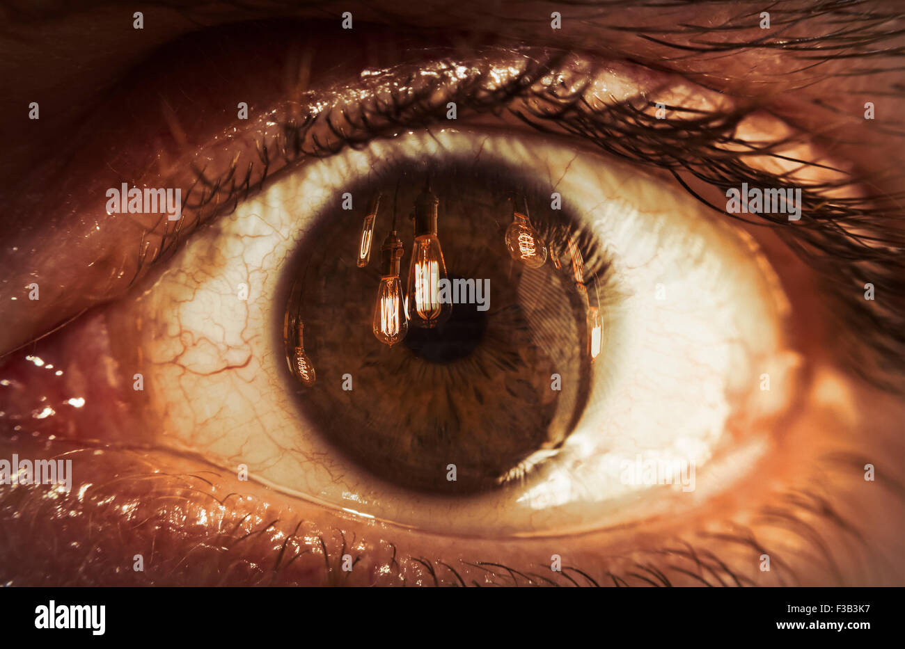Conceptual lightbulb reflection in closeup macro of male eyeball Stock ...