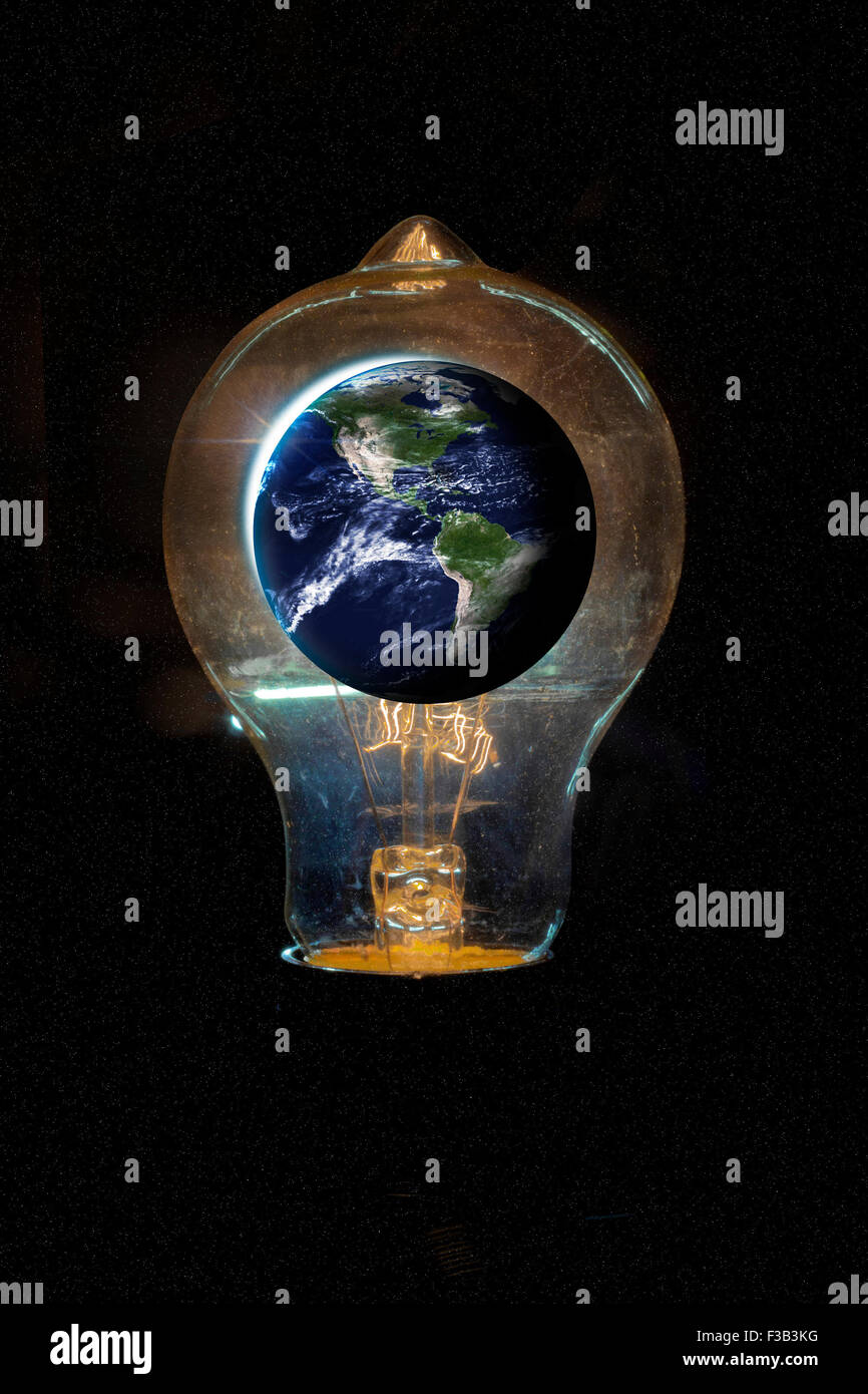 Planet earth and lightbulb for global power and energy concept, light ...