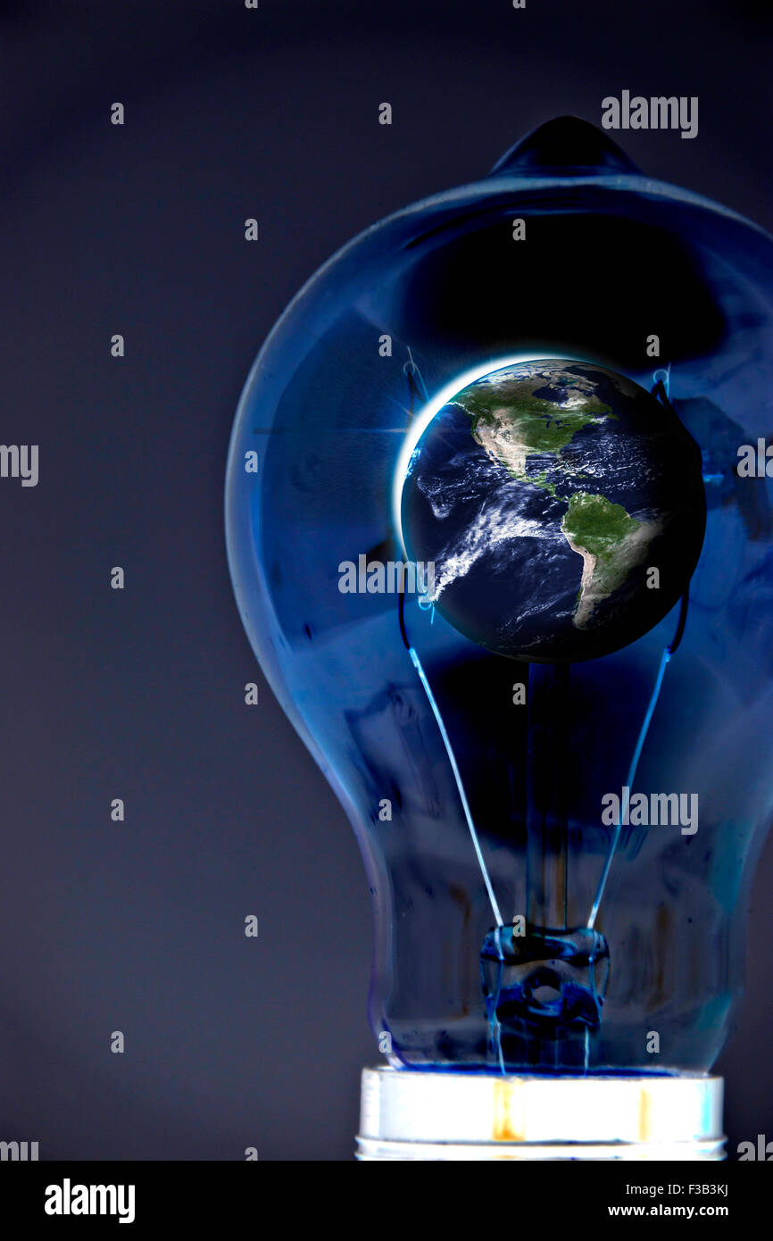 Planet earth and lightbulb for global power and energy concept, light ...