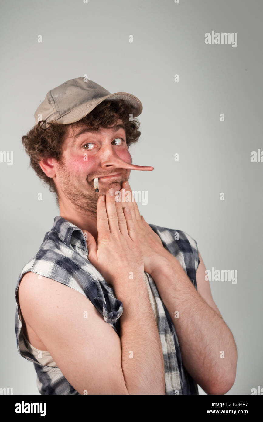 Shocked redneck jumps back in fear as his lying nose grows Stock Photo ...