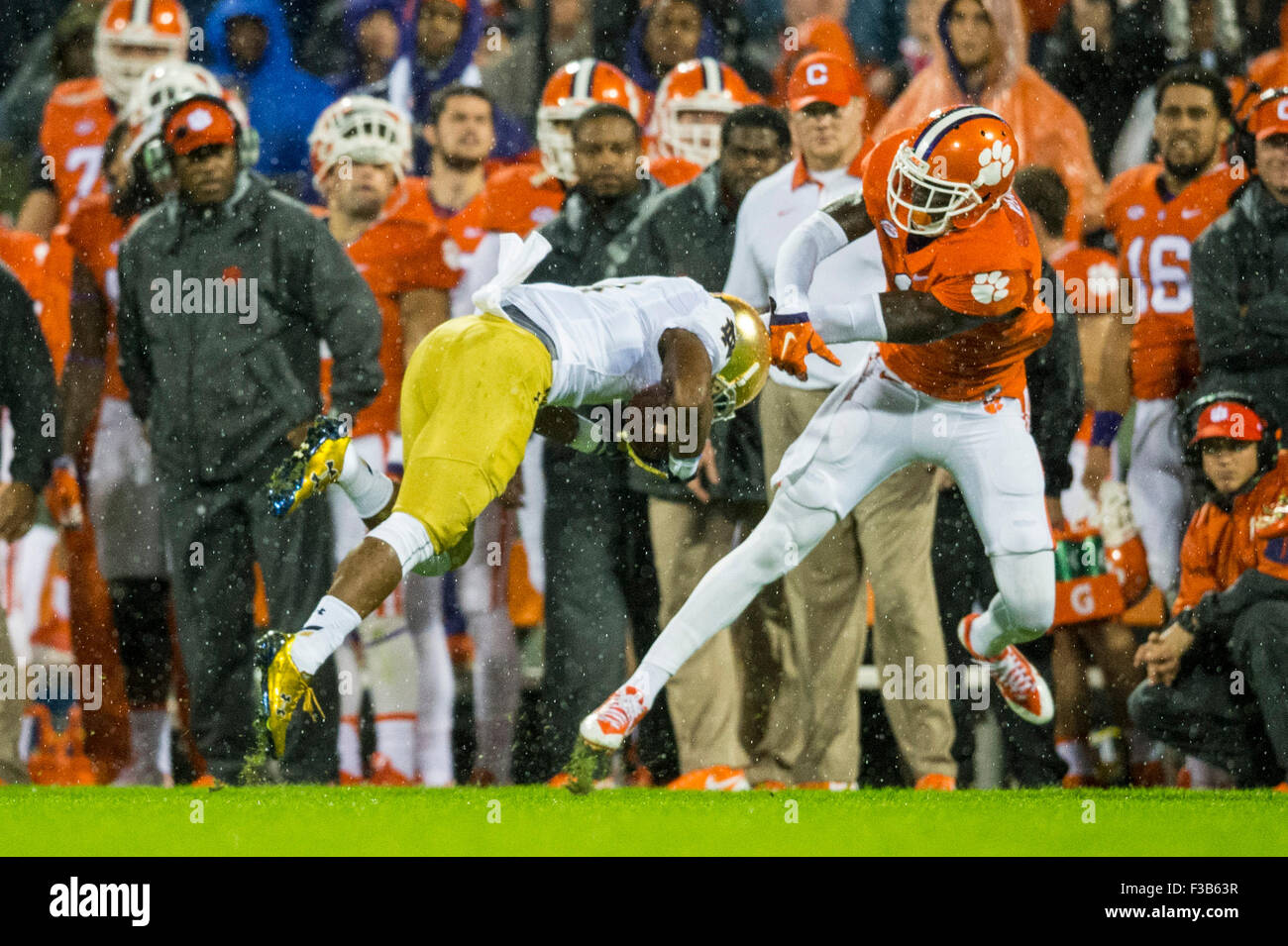 Notre Dame wide receiver C.J. Sanders (9) is brought down by Clemson ...