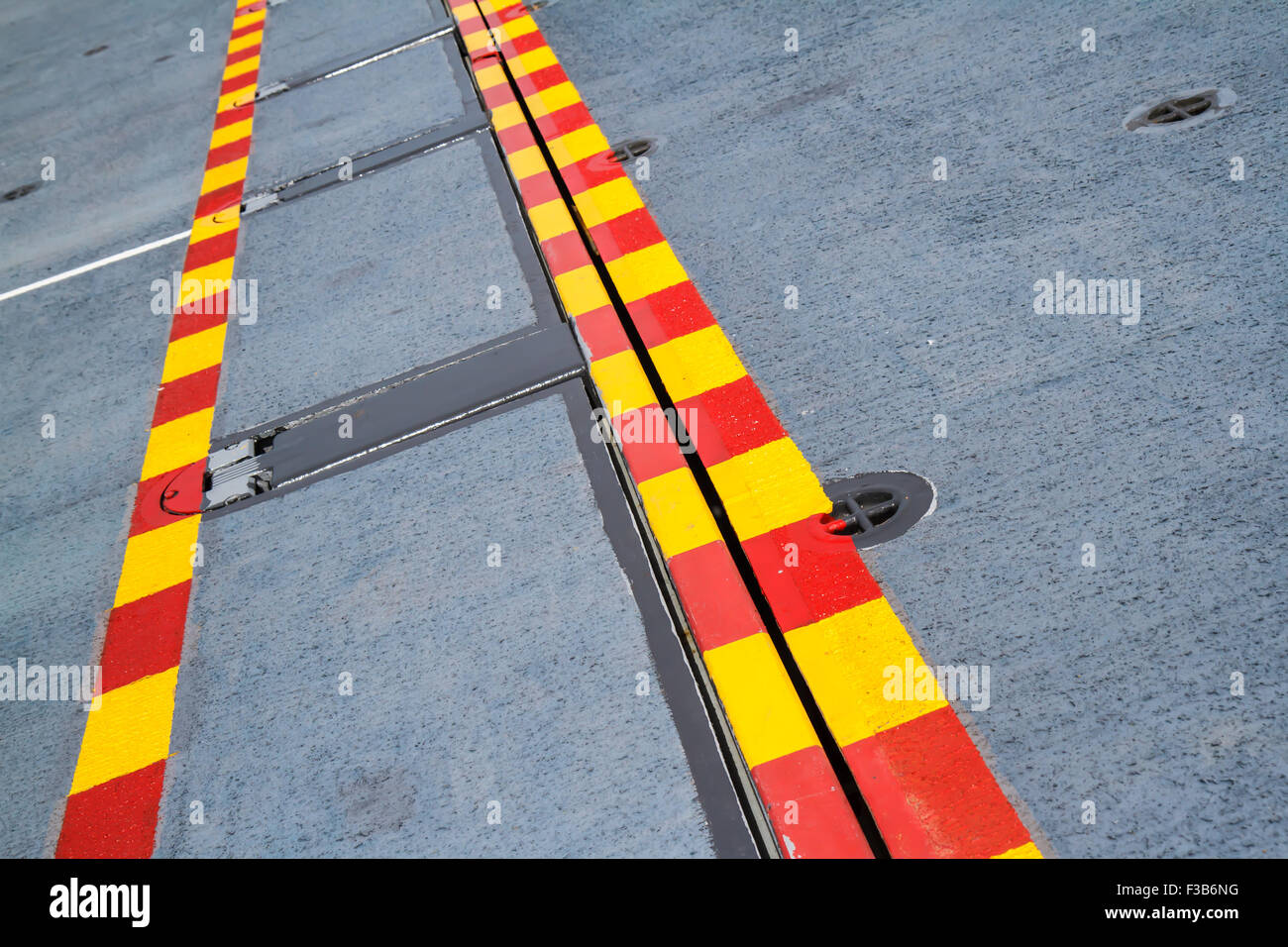 Red yellow line on the steel floor Stock Photo - Alamy