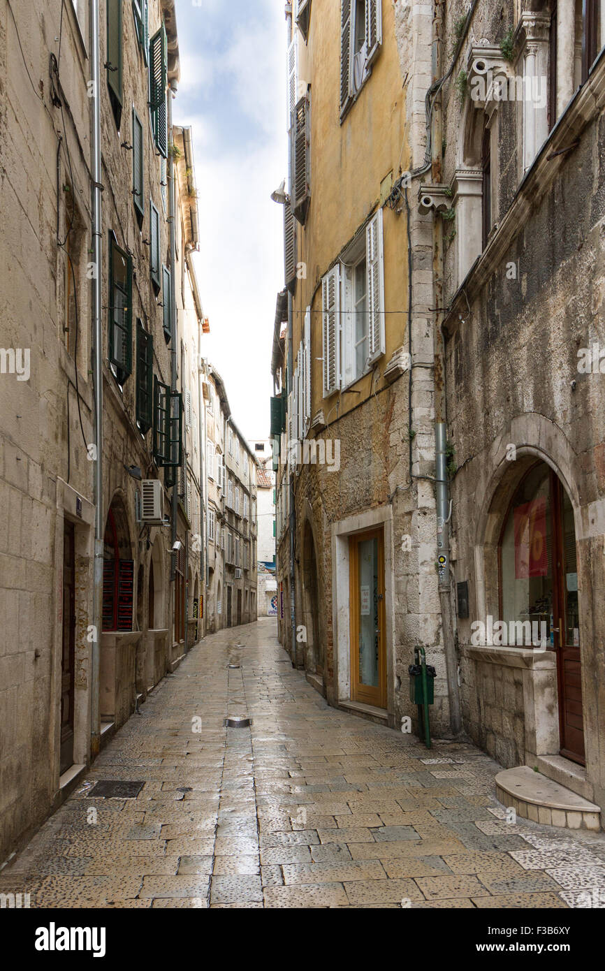 Small and empty alley or pedestrian street at the old town in Split ...
