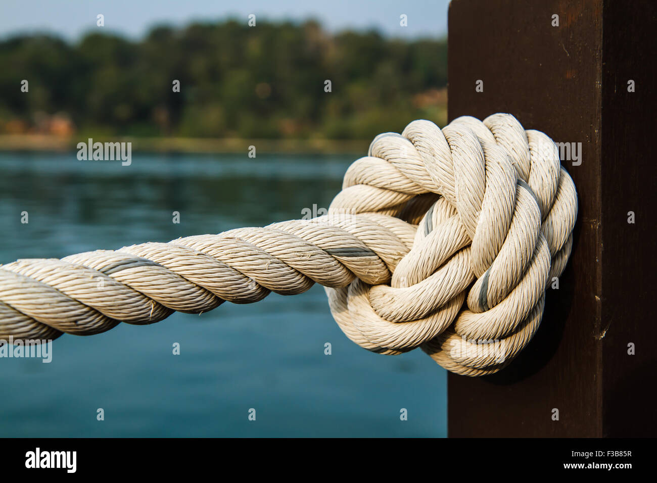 White rope tied into a knot Stock Photo - Alamy