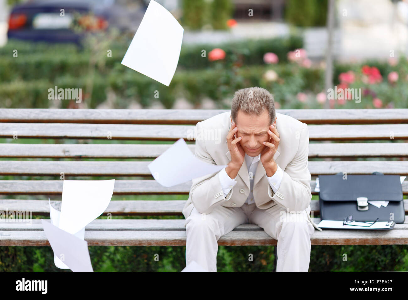 Handsome man sitting on the bench Stock Photo - Alamy