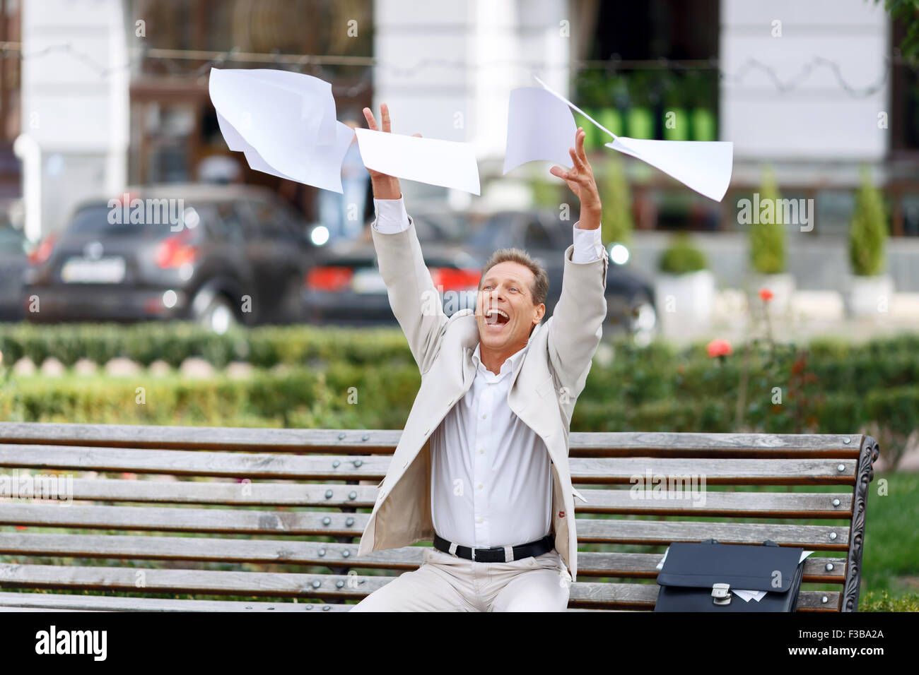 Handsome man sitting on the bench Stock Photo - Alamy