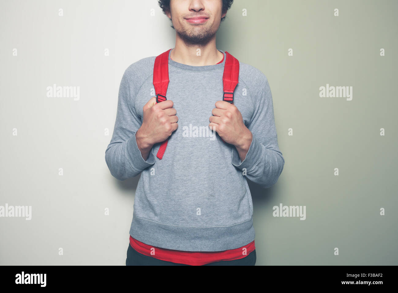 Man wearing backpack standing hi-res stock photography and images - Alamy